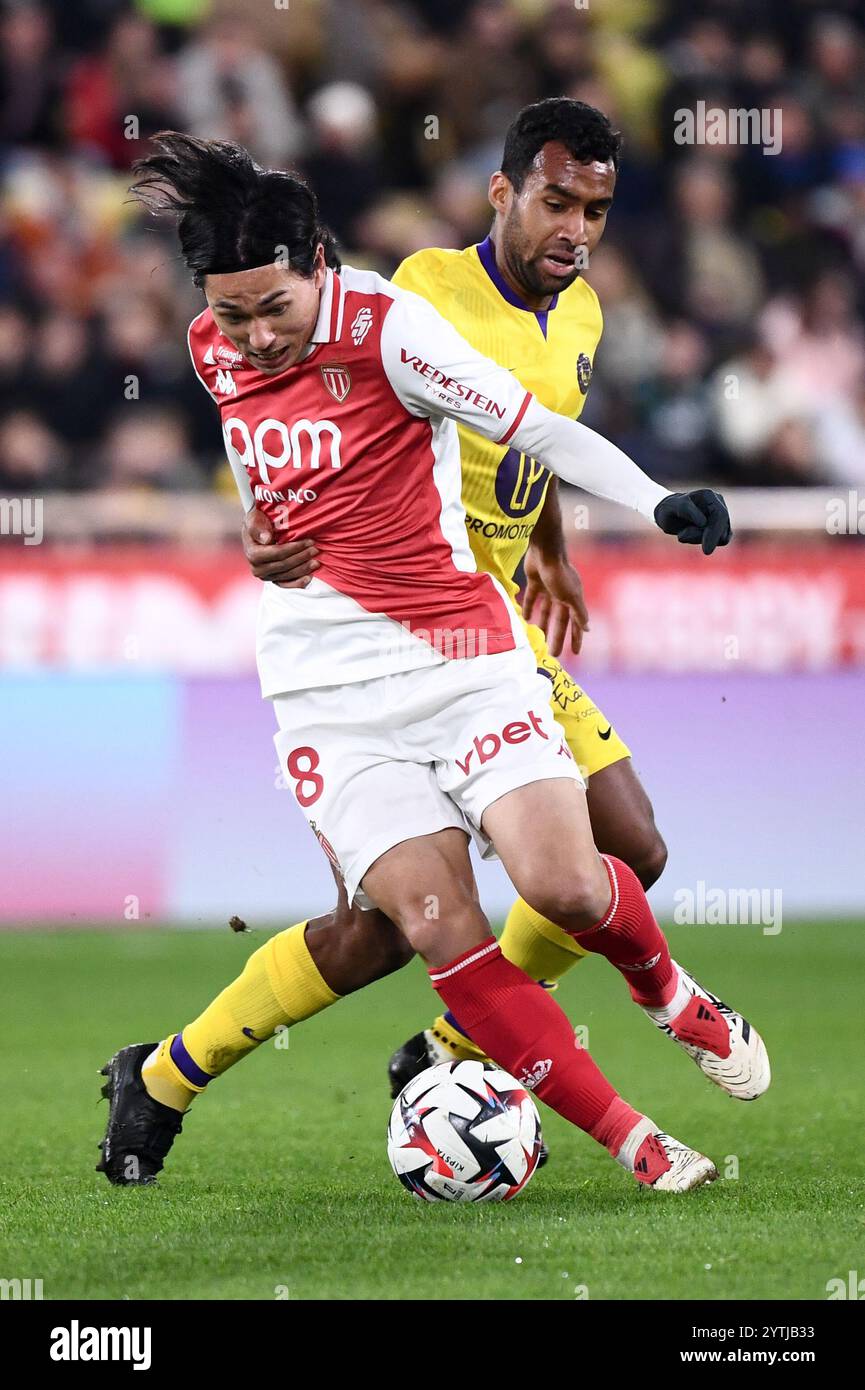 18 Takumi MINAMINO (asm) - 23 Cristian CASSERES JR (tfc) during the Ligue 1 McDonald's match ...