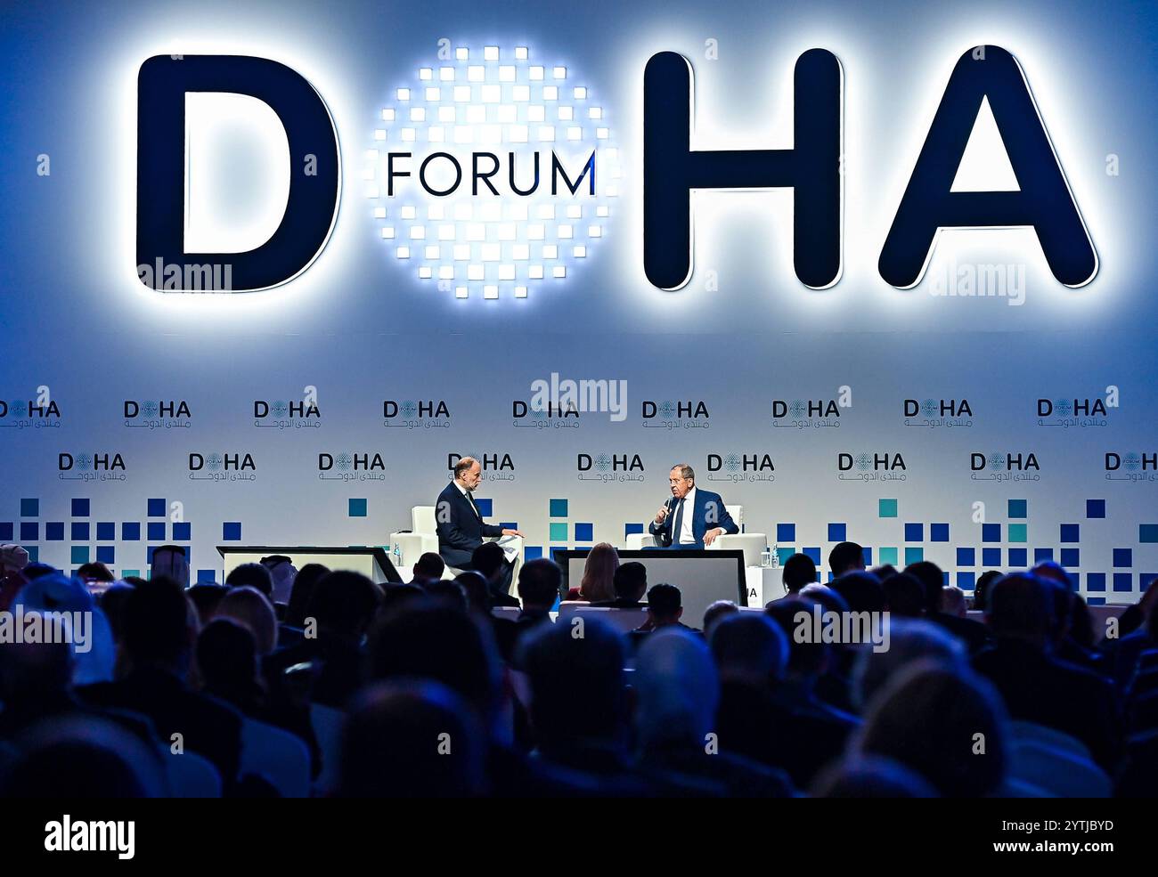 DOHA FORUM 2024 Russian Foreign Minister Sergei Lavrov R answers questions during the Doha Forum ...