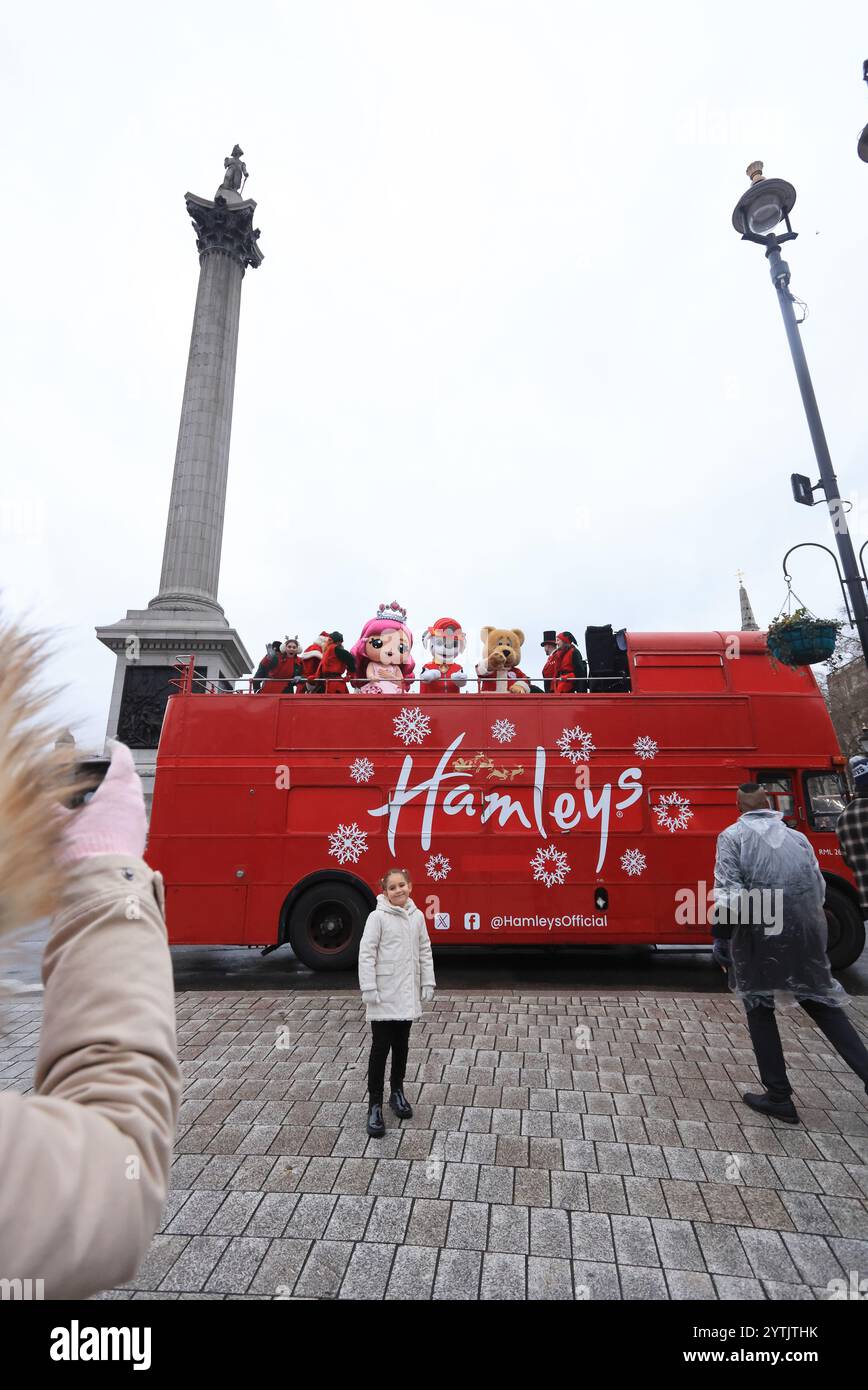 Characters on Hamleys Christmas Bus toured round Trafalgar Square, a ...