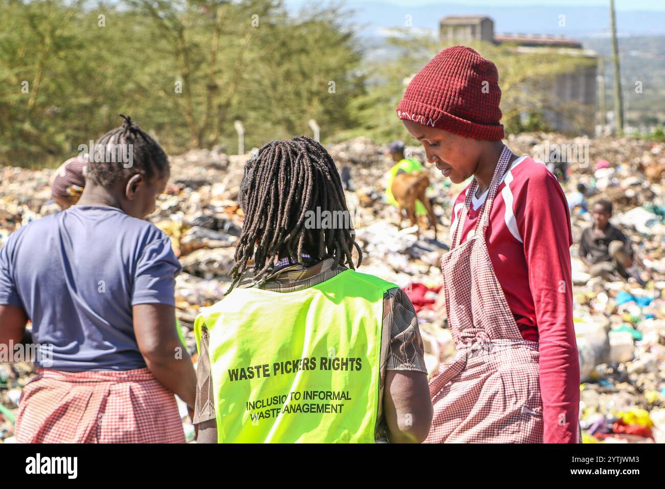 Women waste pickers are seen talking at Gioto dumpsite. Negotiations to ...