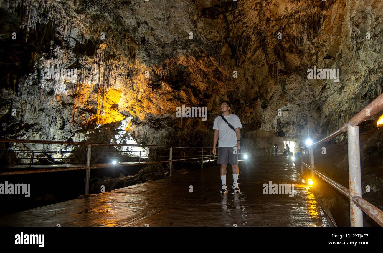 Visitors wander through the impressive tunnels of Cacahuamilpa National ...