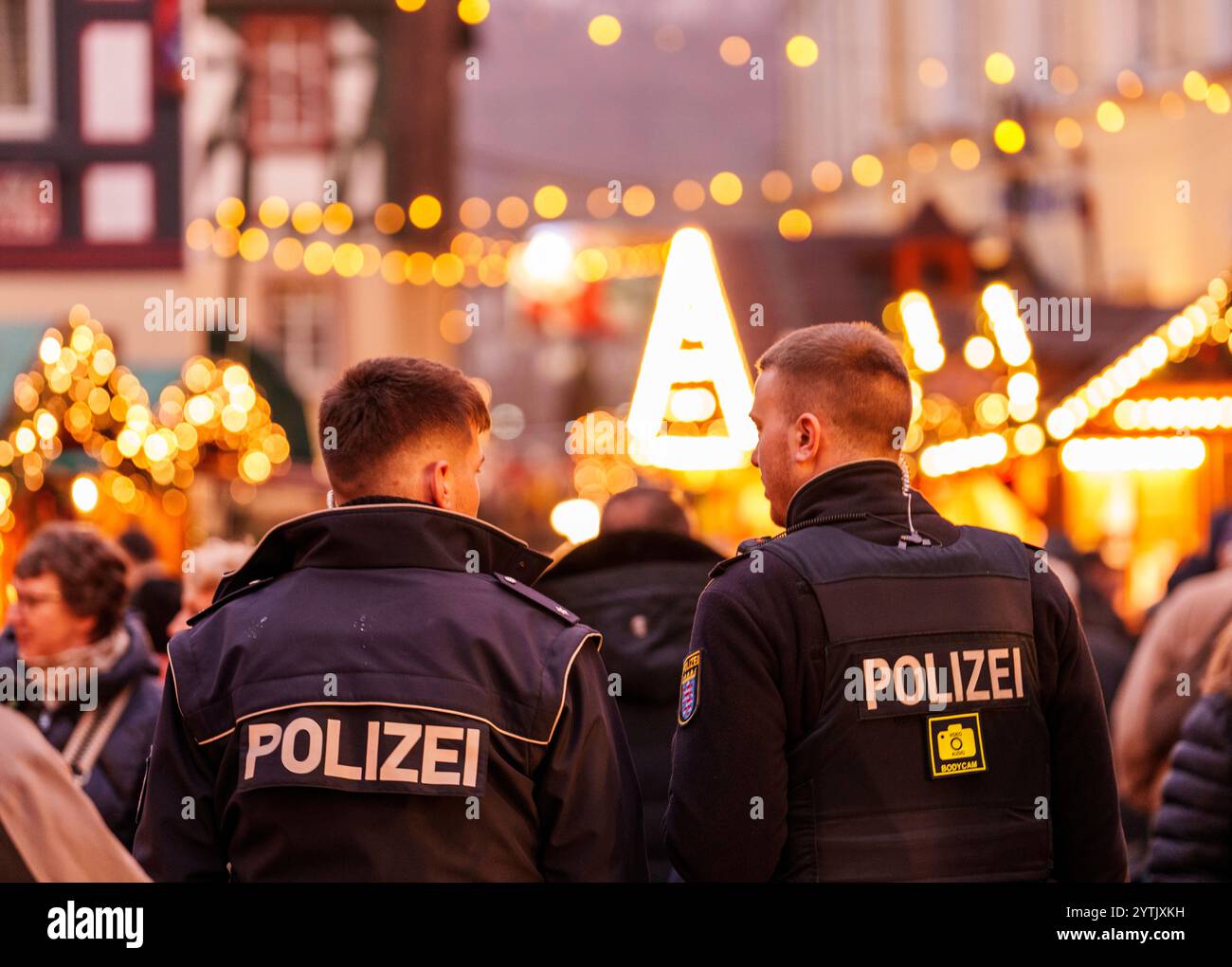 07 December 2024, Hesse, Rüdesheim: Police patrol the Christmas market ...