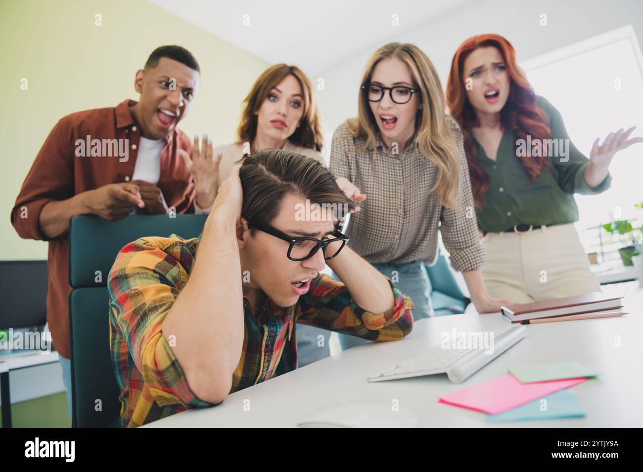 Photo of furious angry students screaming guilty friend making mistake ...