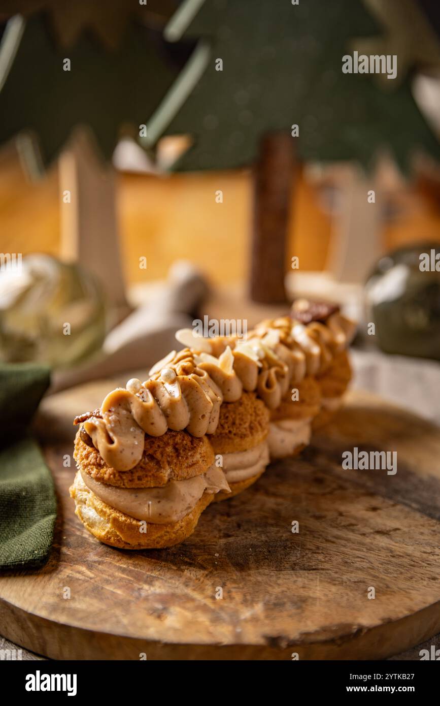 Delicious Christmas eclair showing chestnut cream filling on wooden ...