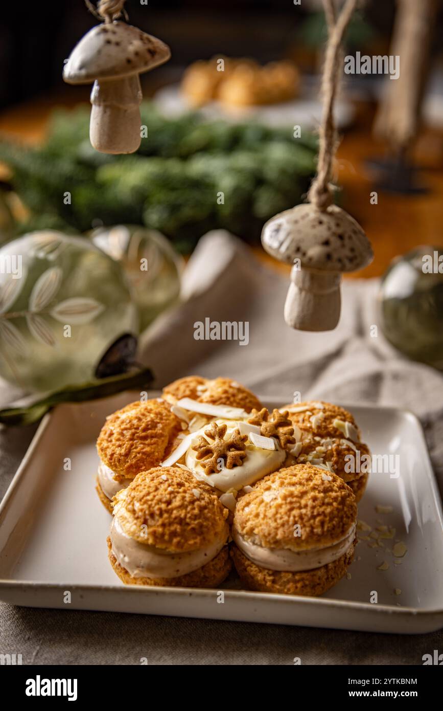 Delicious cream puffs forming flower shape on festive Christmas table ...