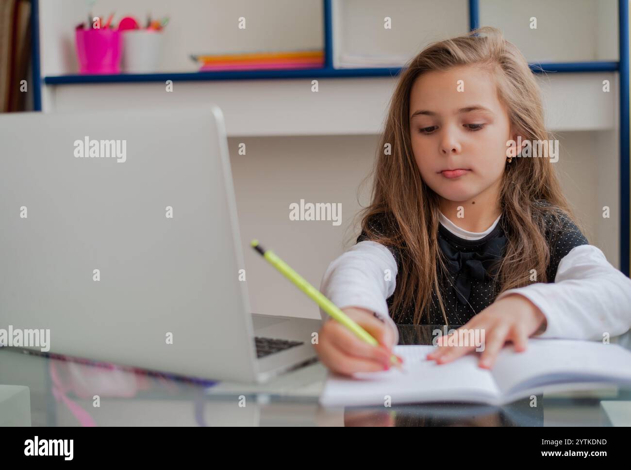 A student kid learning for school at the home desk Stock Photo - Alamy