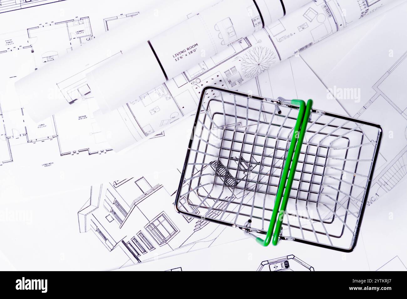 Construction plan in grocery basket. House design project. Miniature ...