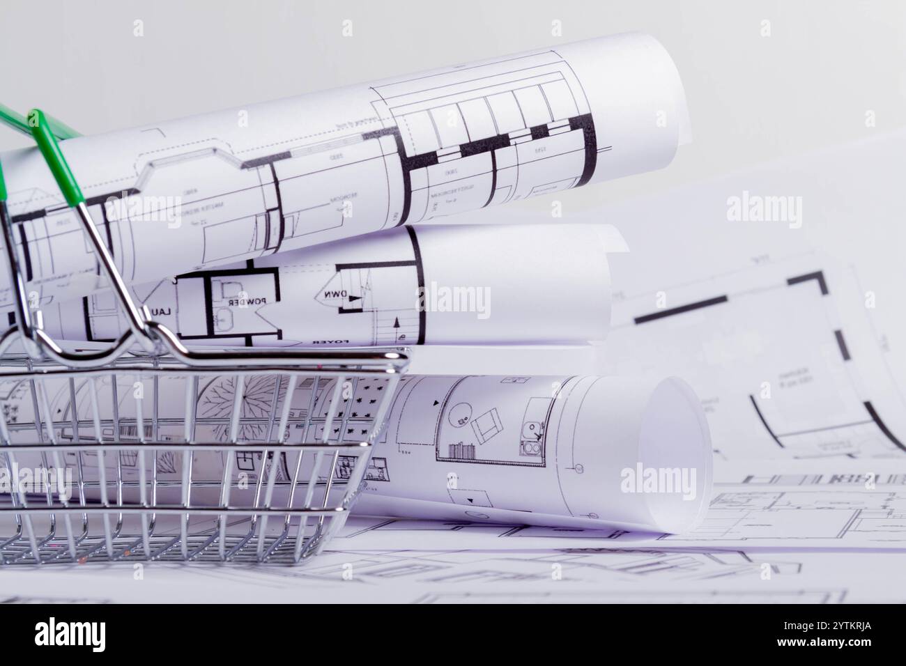 Construction plan in grocery basket. House design project. Miniature ...