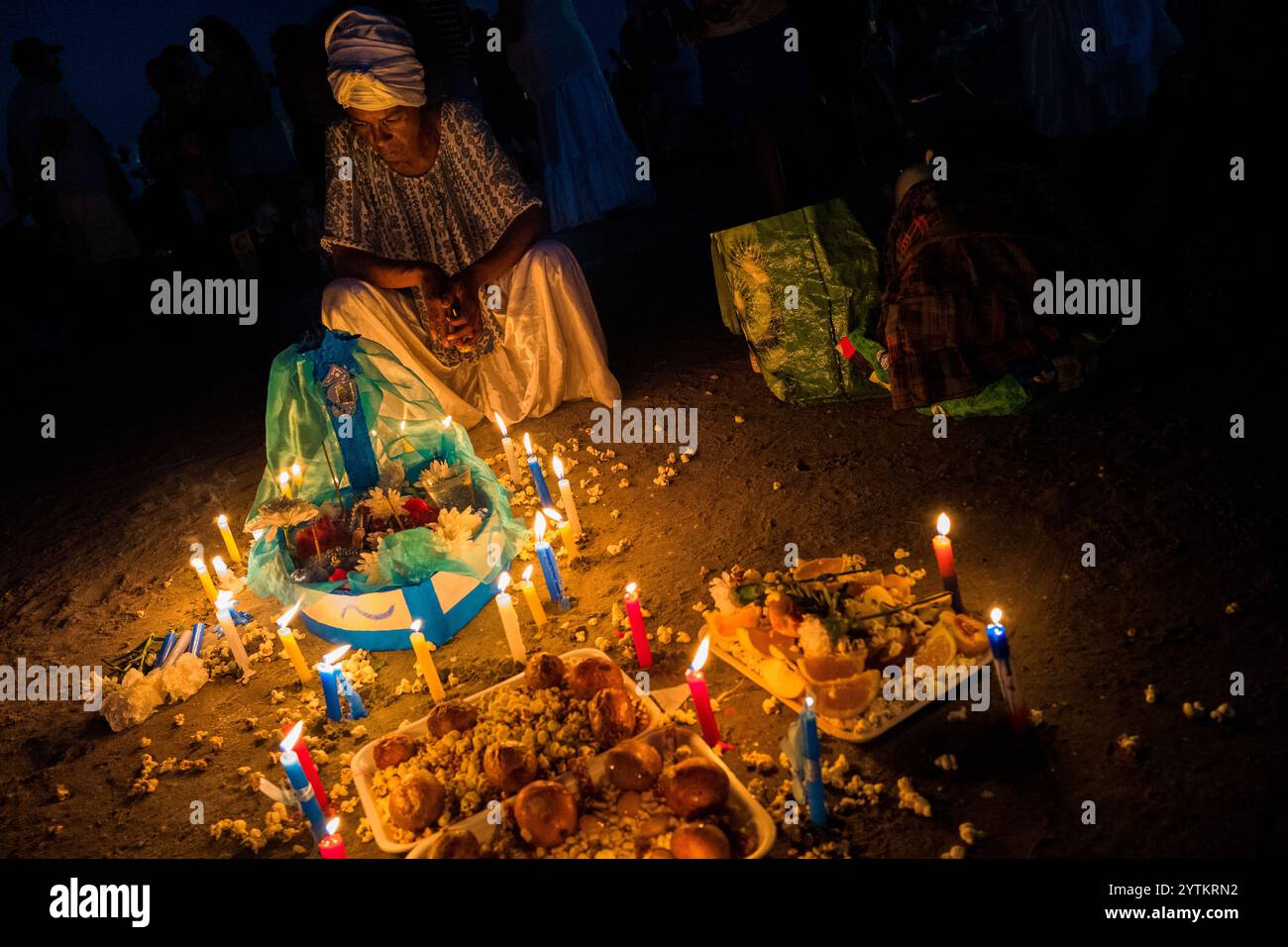 A devotee of Umbanda, the Afro-Uruguayan religious tradition, pays ...