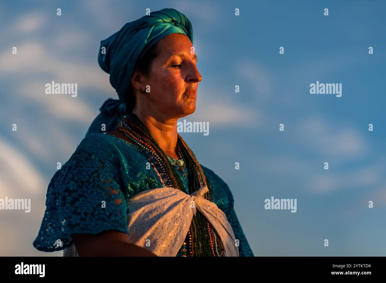 A worshiper of Umbanda, the Afro-Uruguayan religious cult, prays to the ...