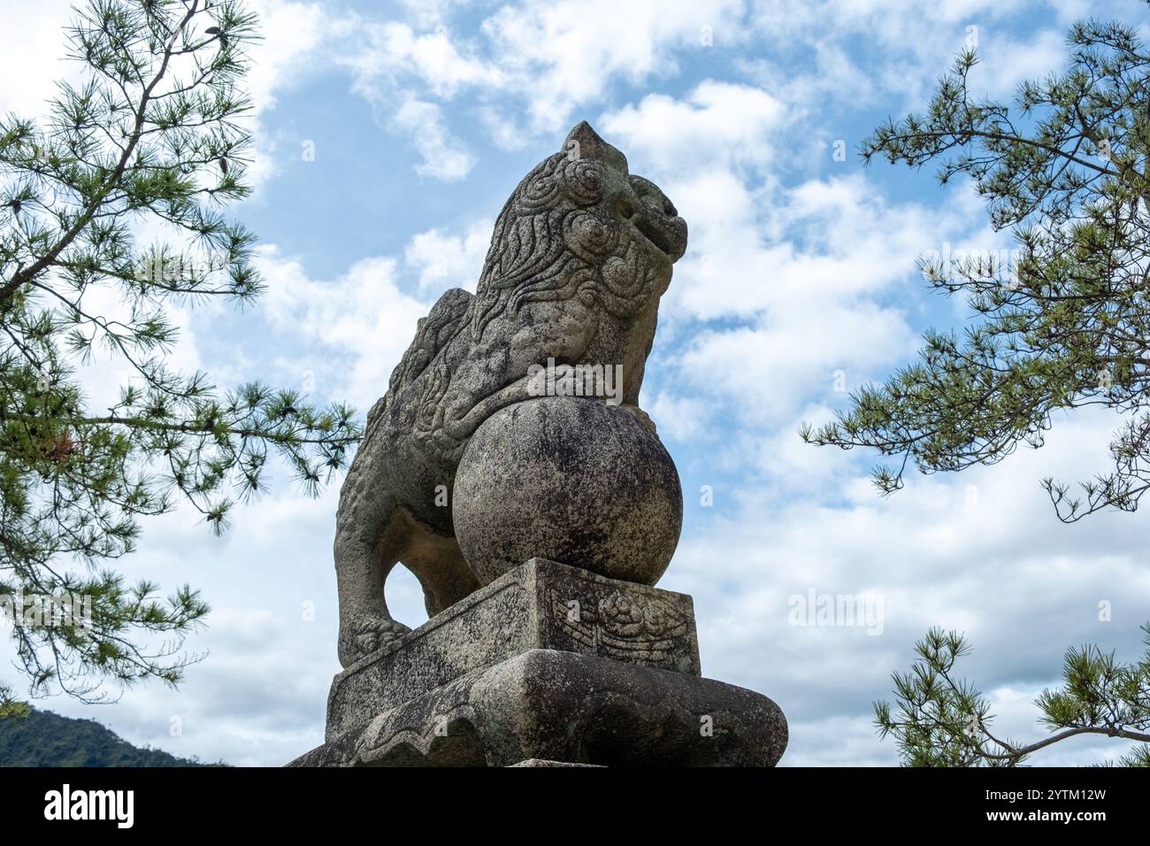 Komainu, a traditional Japanese lion dog statue at Itsukushima Shrine ...