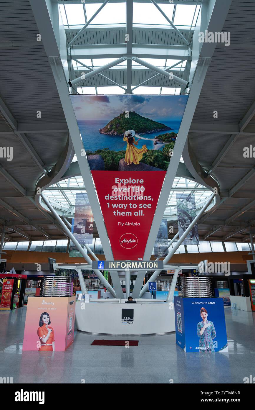 SENAI, MALAYSIA - NOVEMBER 22, 2023: the information desk, featuring an ...