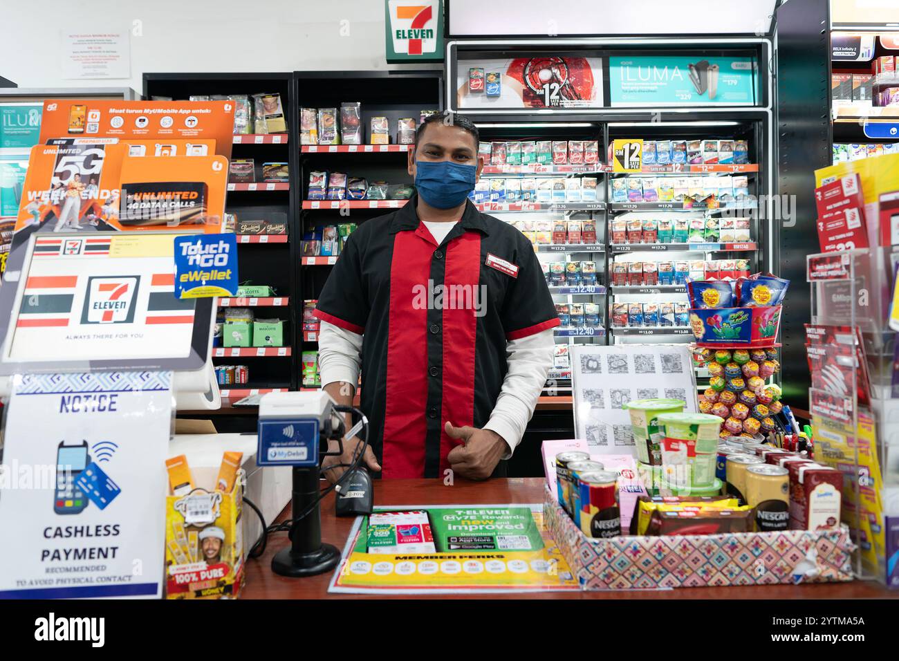 KUALA LUMPUR, MALAYSIA - NOVEMBER 08, 2023: a cashier poses for a photo ...