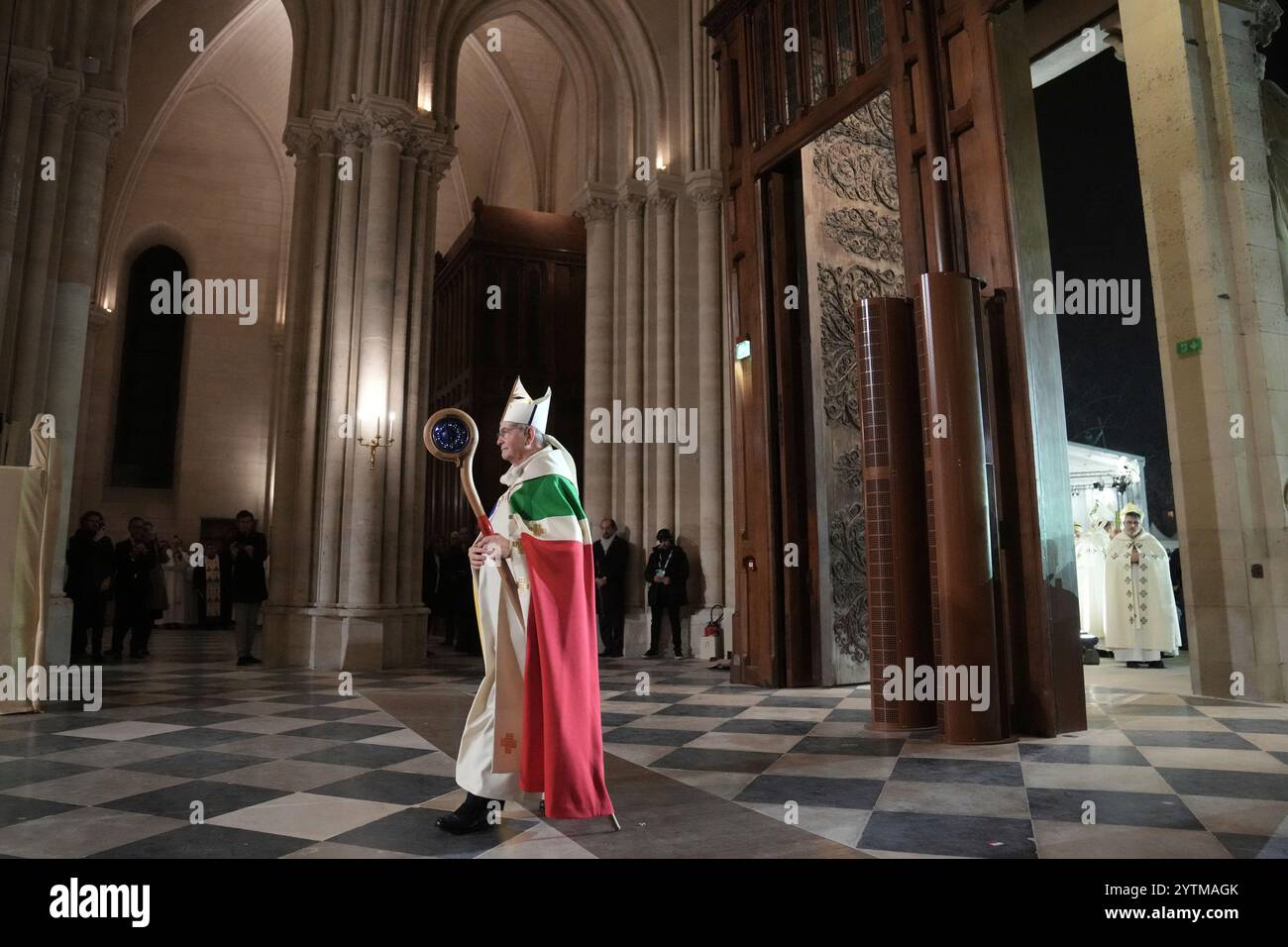 Paris' archbishop Laurent Ulrich enters Notre Dame Cathedral as France ...