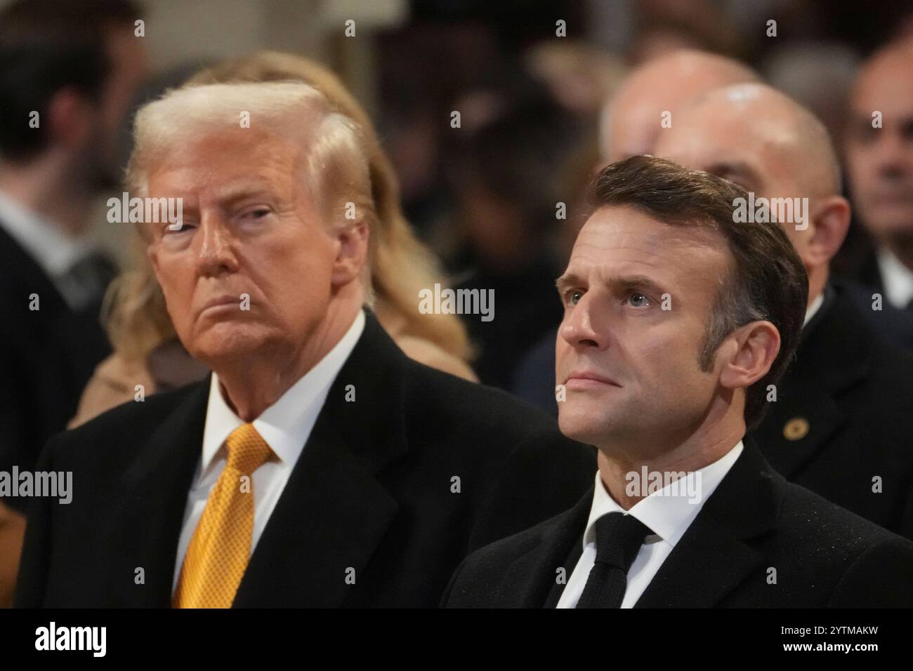 President-elect Donal Trump looks at French President Emmanuel Macron ...