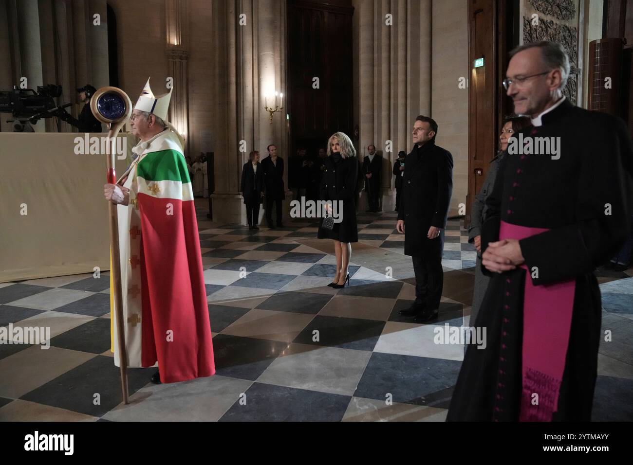 Paris' archbishop Laurent Ulrich enters Notre Dame Cathedral, followed ...