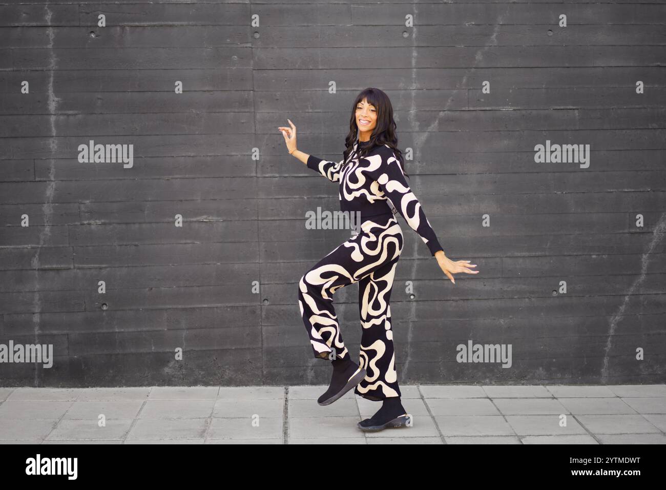 Cute modern dancer stepping while dancing a choreography outdoors Stock ...
