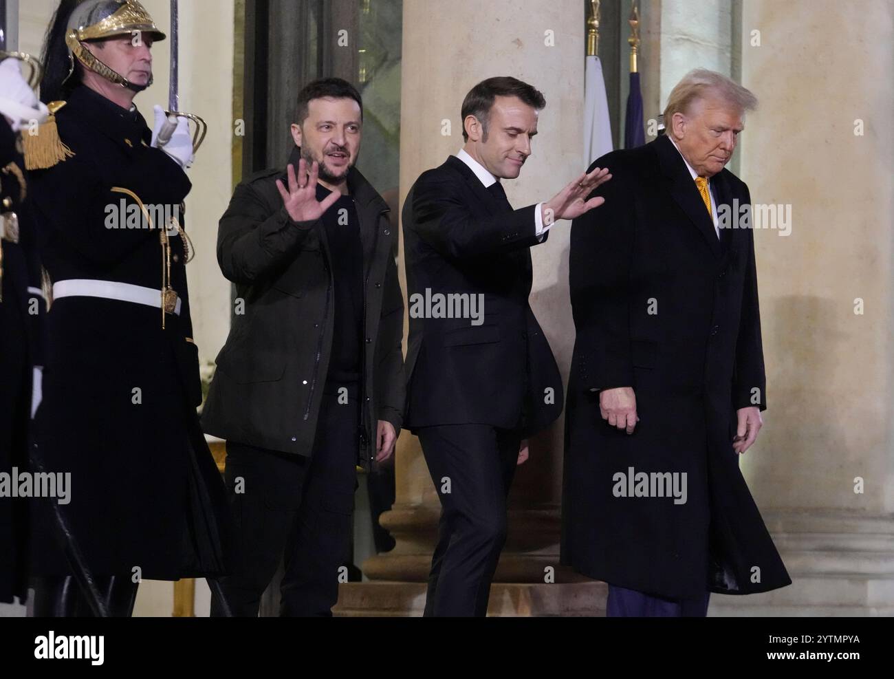 French President Emmanuel Macron, center, President-elect Donald Trump ...