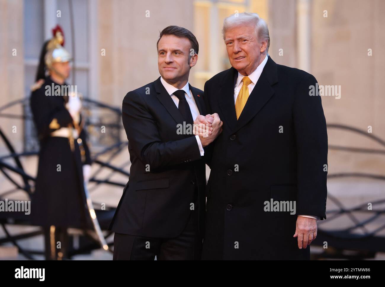 Paris, France. 07th Dec, 2024. French President Emmanuel Macron greets ...