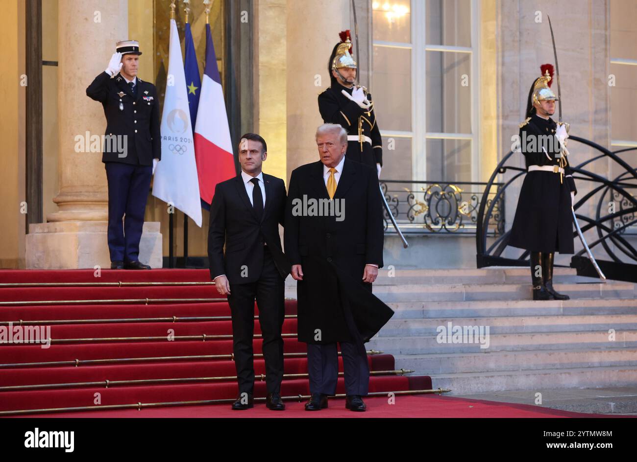 Paris, France. 07th Dec, 2024. French President Emmanuel Macron greets ...