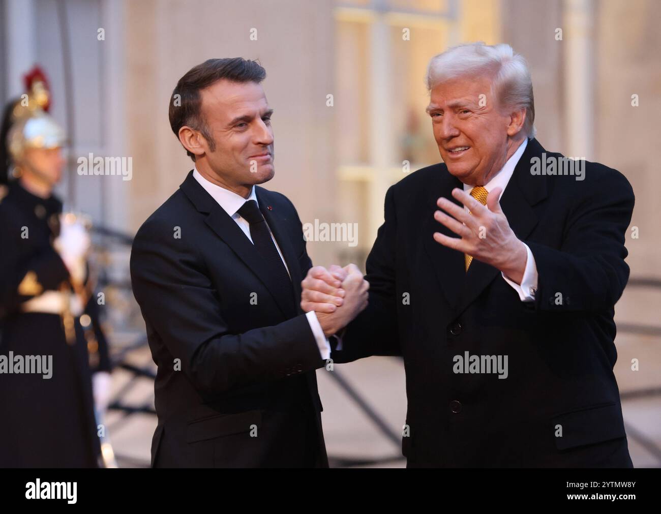 Paris, France. 07th Dec, 2024. French President Emmanuel Macron greets ...