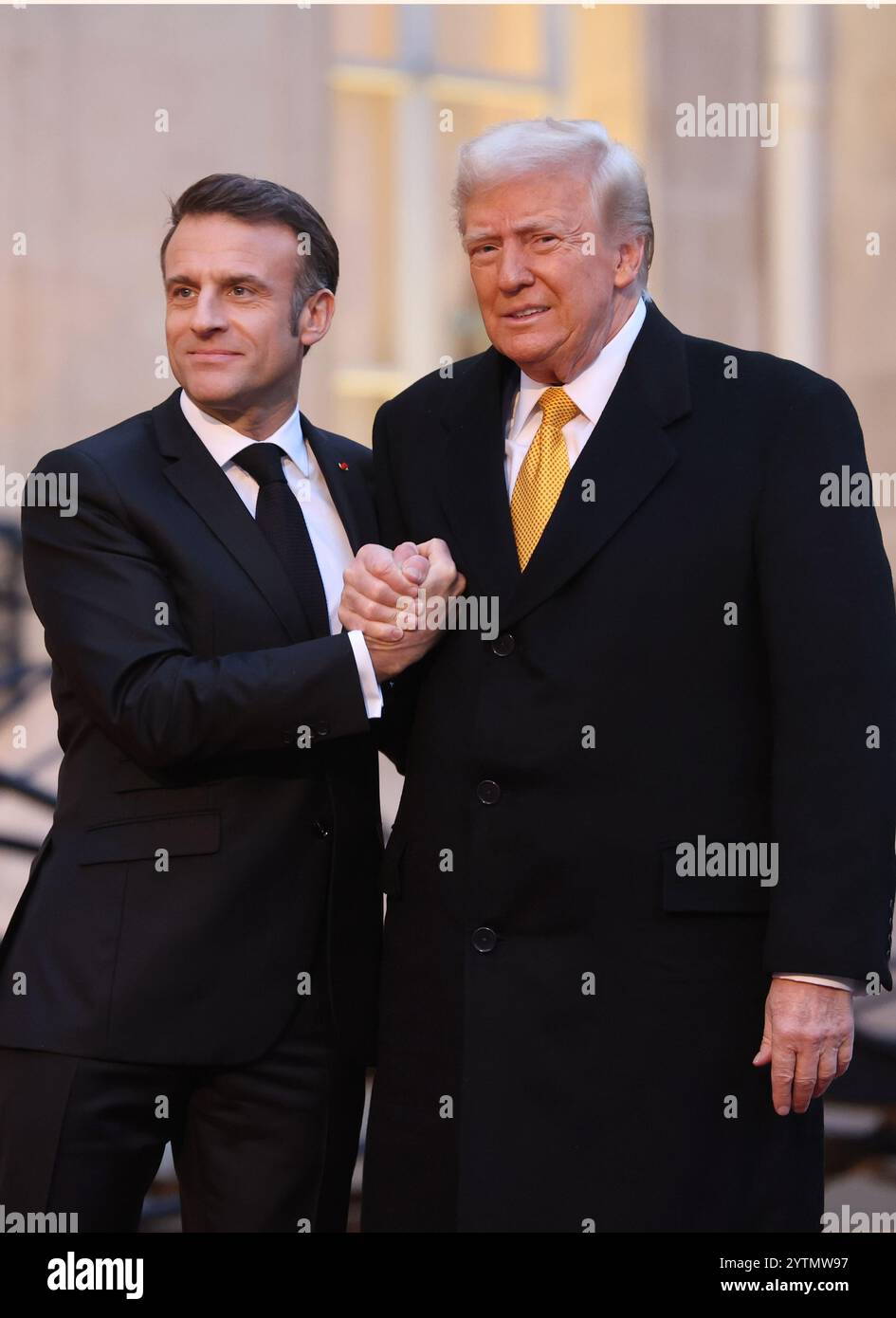 Paris, France. 07th Dec, 2024. French President Emmanuel Macron greets ...