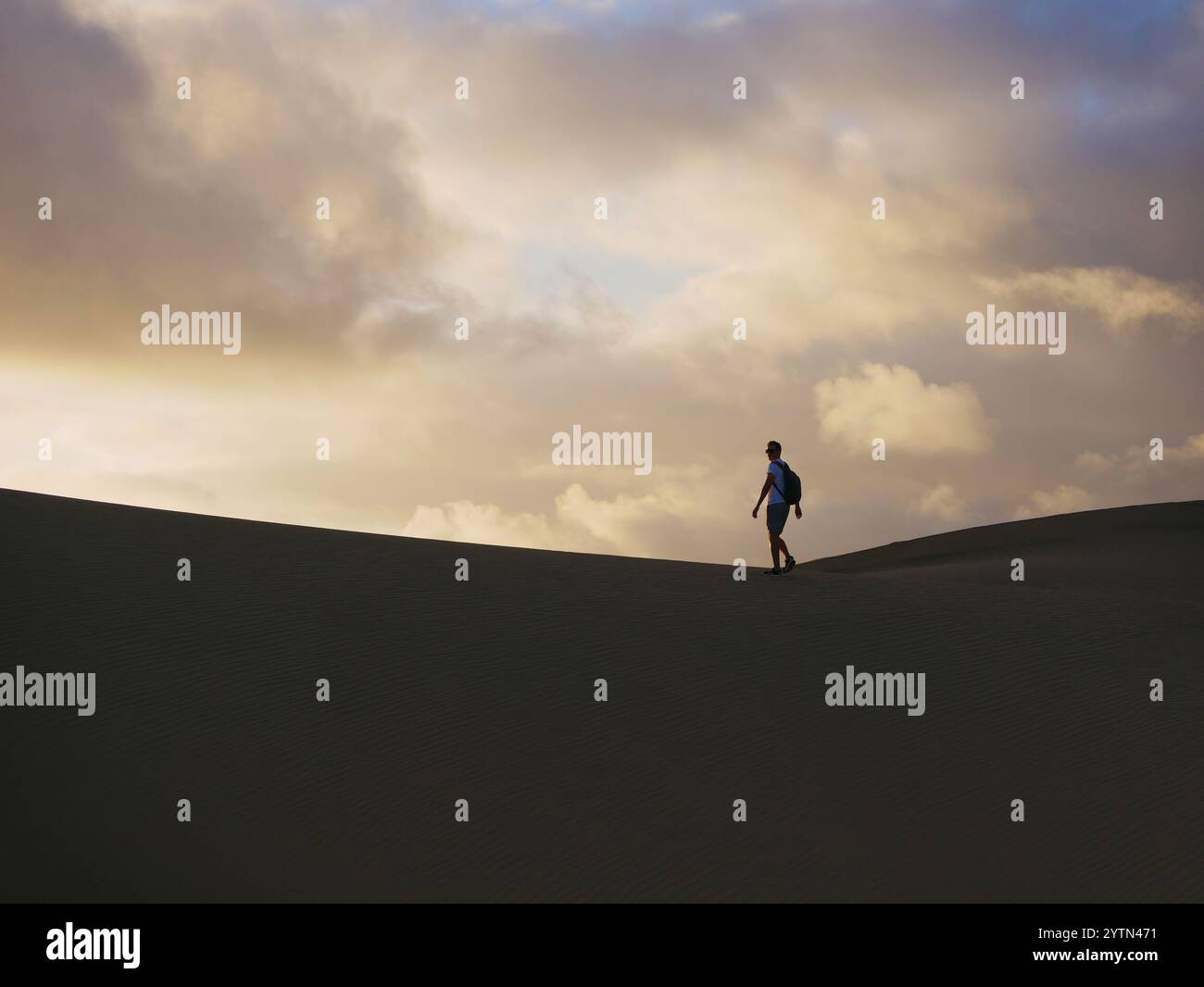 Man backpack walks on desert hi-res stock photography and images - Alamy