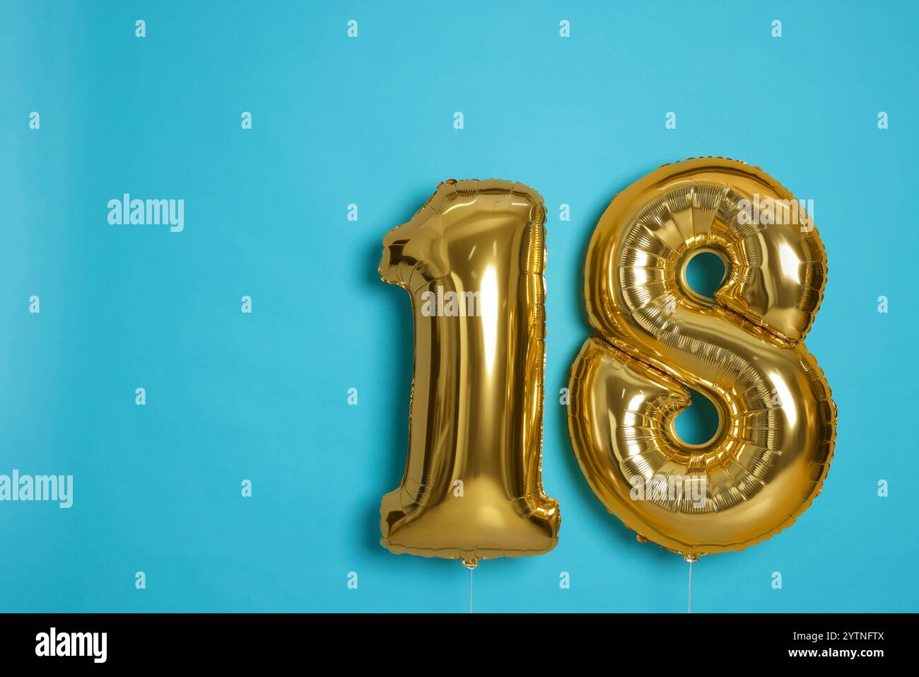 Coming of age party - 18th birthday. Number shaped balloons on light ...