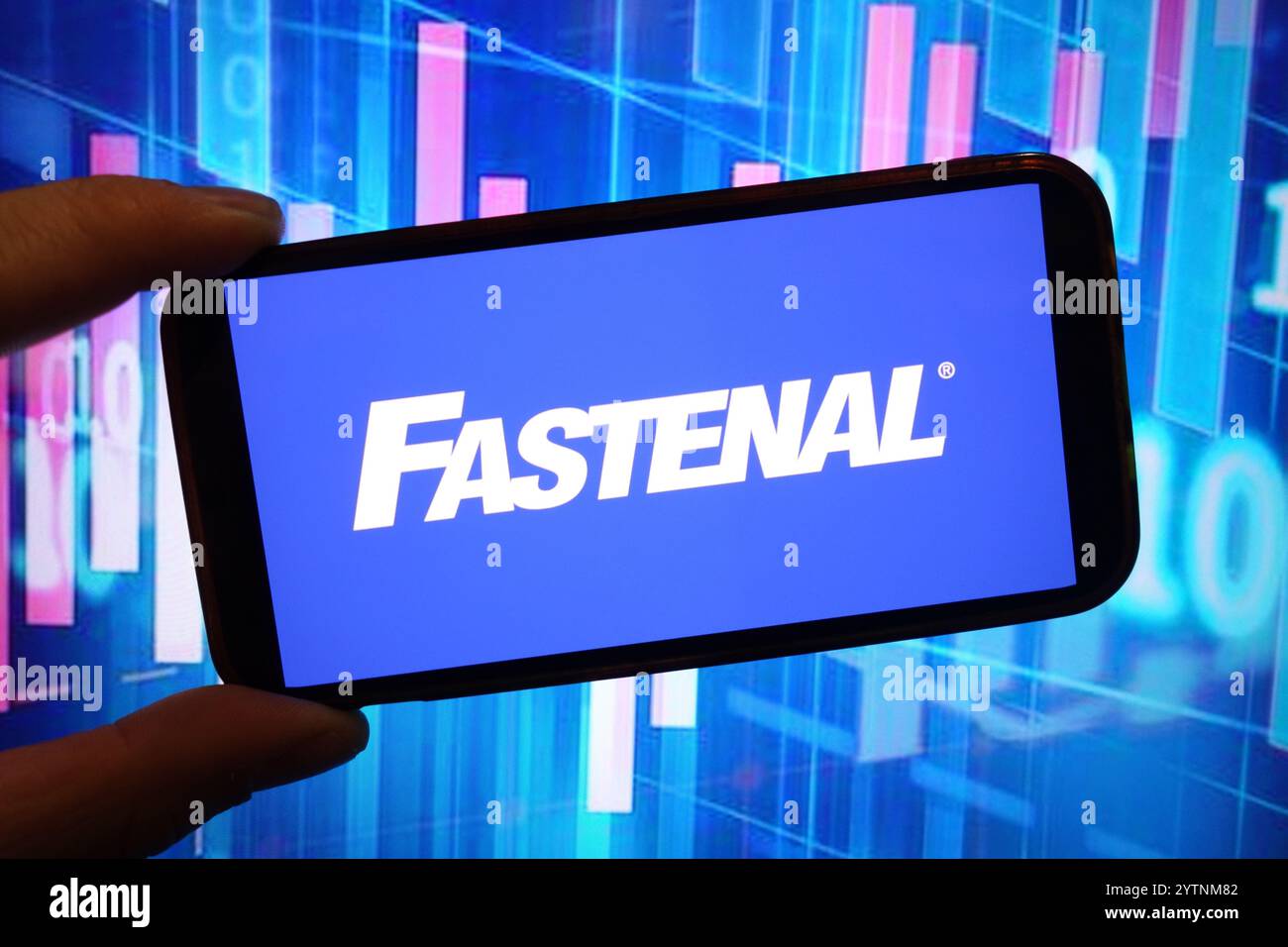 In this photo illustration, the Fastenal company logo is seen displayed ...