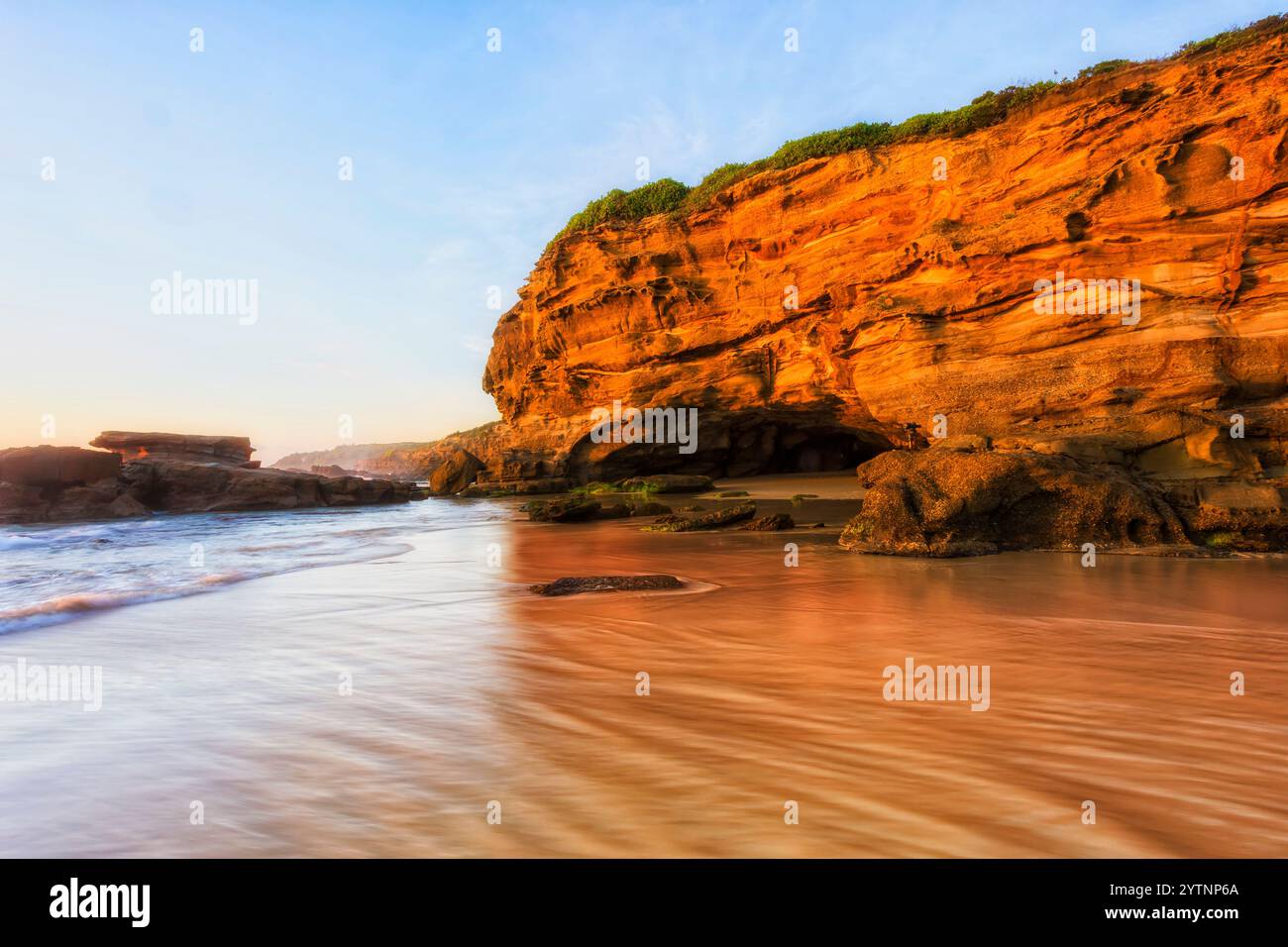 Sandestone natural sea cave at Caves beach on Pacific coast of ...