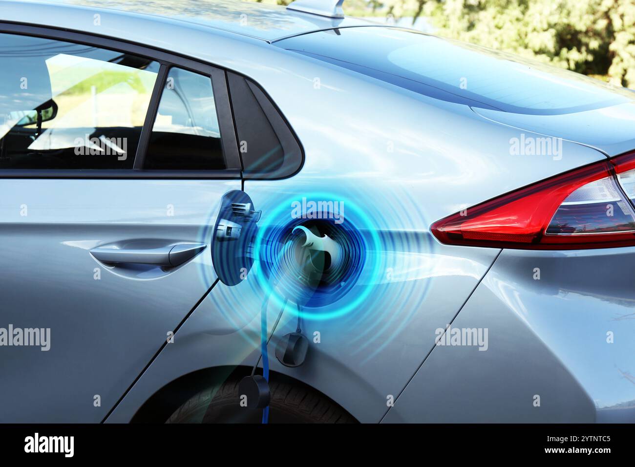 Charging modern electric car from station outdoors. Round pulse waves ...