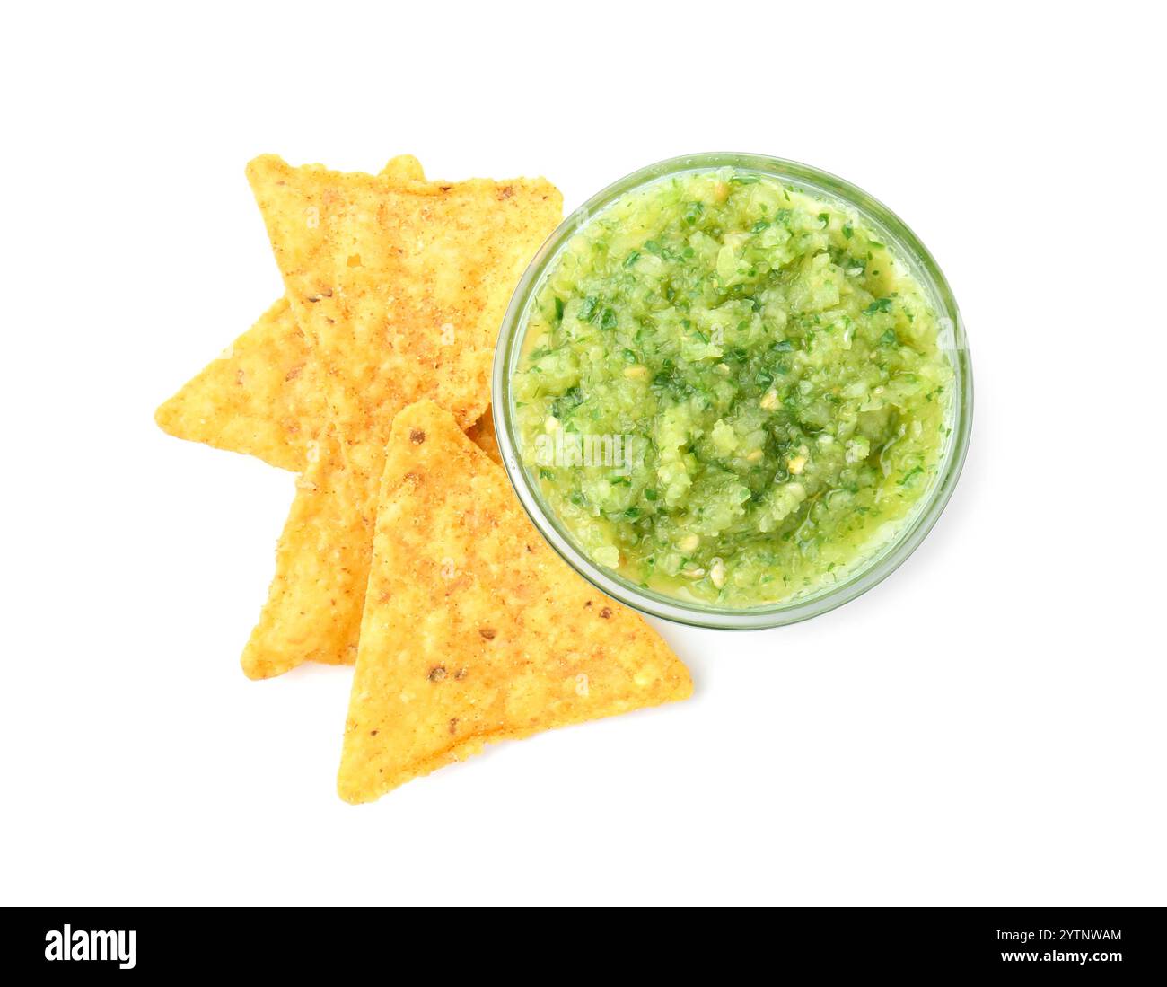 Delicious homemade green salsa with nachos isolated on white, top view ...