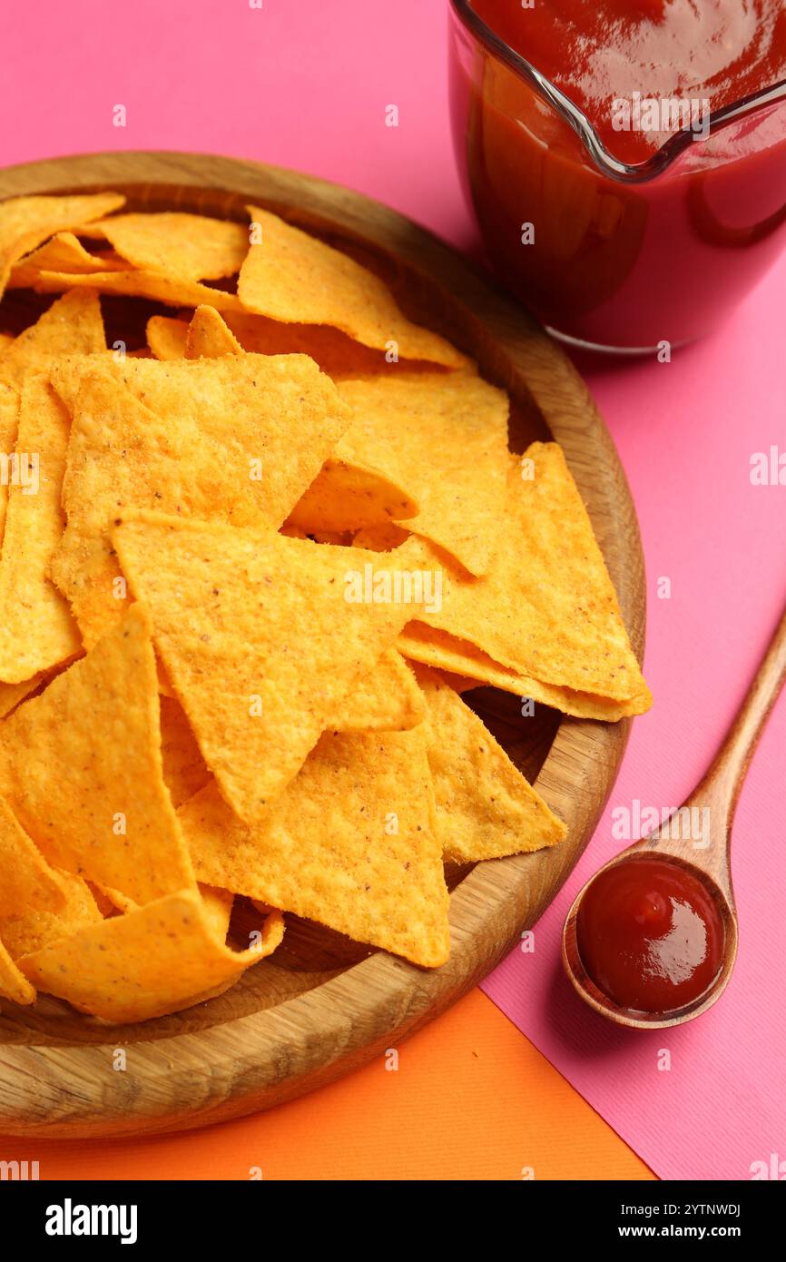 Tasty ketchup and nachos on color background, closeup Stock Photo - Alamy