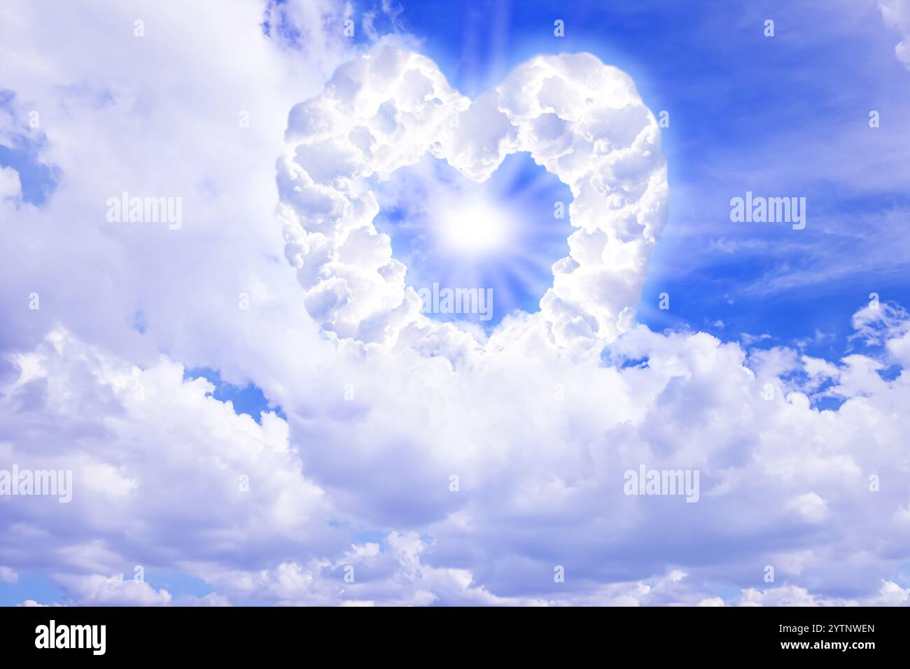Bright light shining through heart made of clouds in sky. Love of God ...
