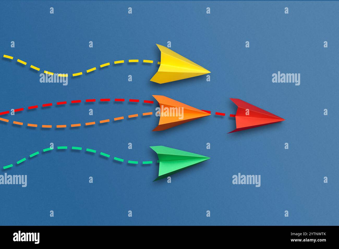 Colorful paper planes with flight paths on blue background. Dashed ...