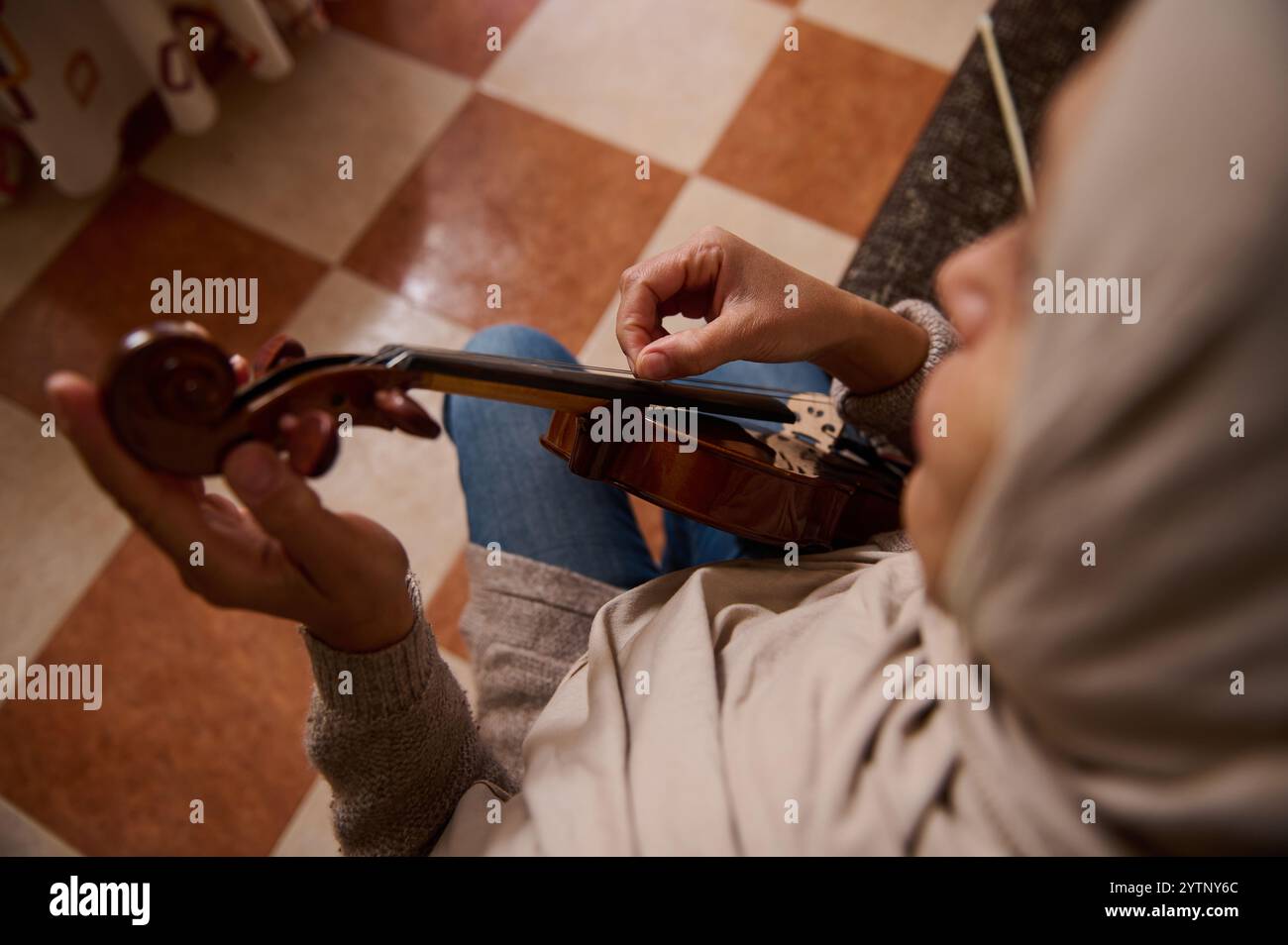 A close perspective of a person skillfully playing a violin, focusing ...