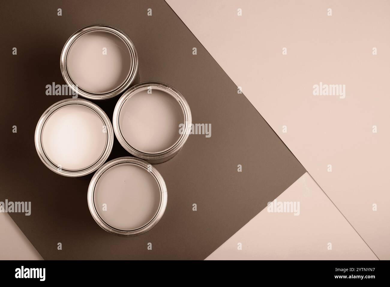 Four paint cans on a brown and beige background in soft lighting Stock ...