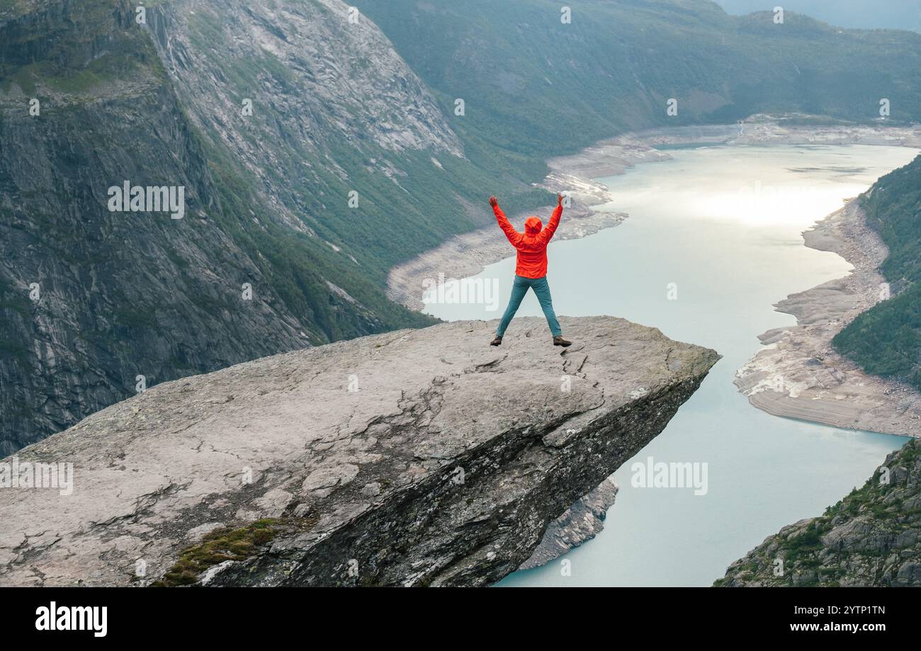 Woman trekker dressed bright red jacket enjoying glacier ...