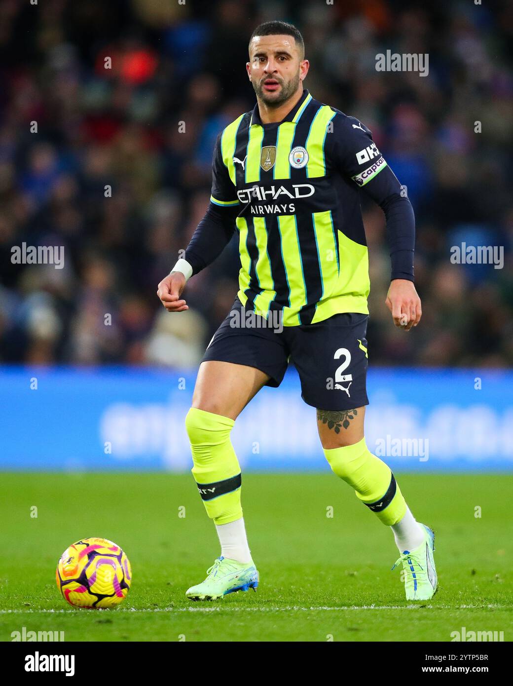 Kyle Walker of Manchester City runs with the ball during the Premier ...