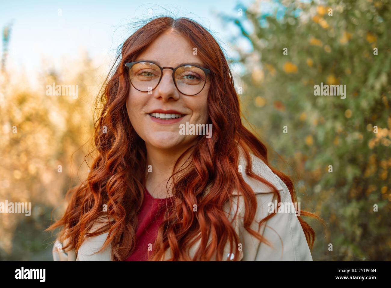 Hello october. Portraits of a charming red-haired girl with a cute face ...