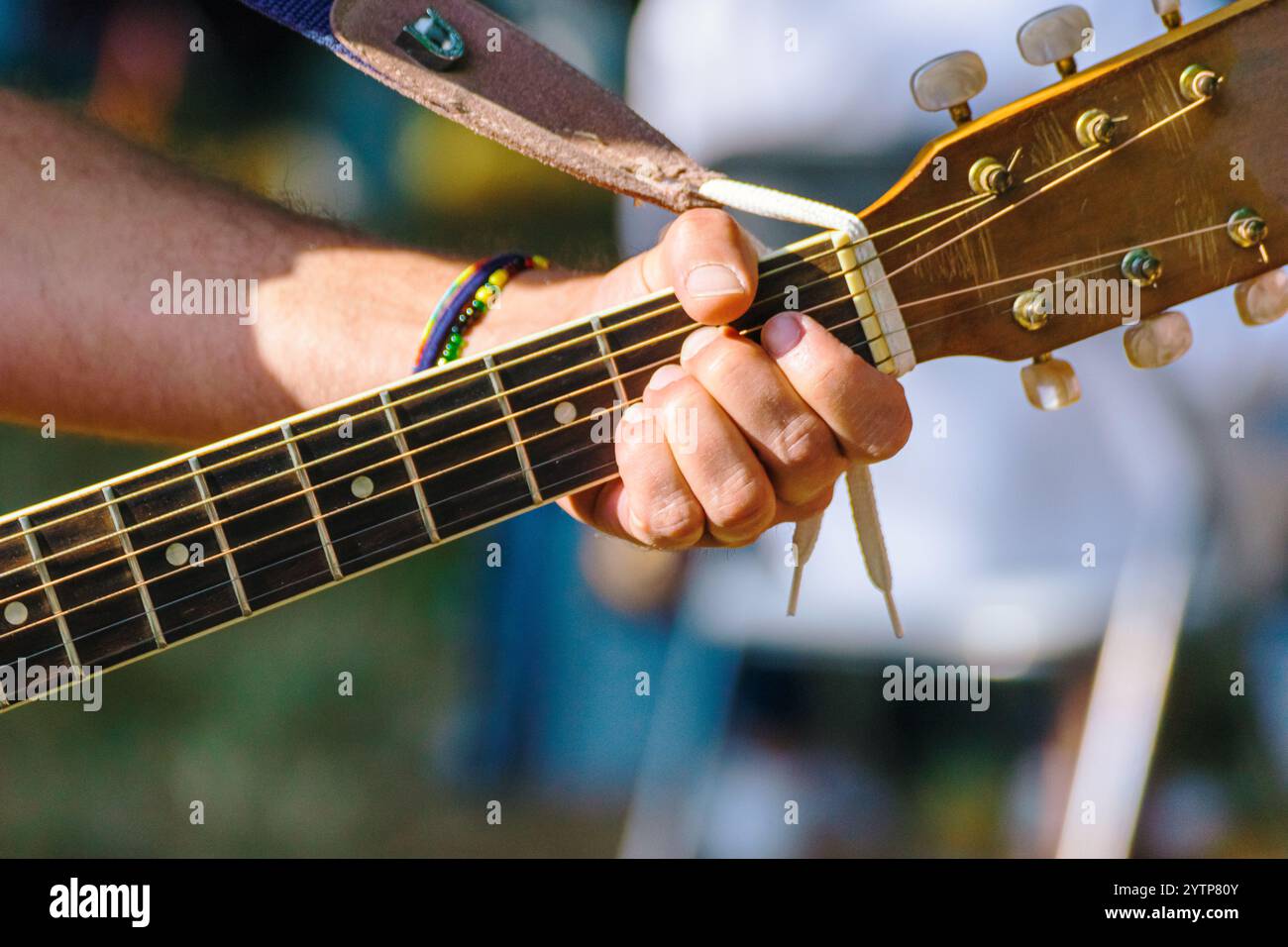 detailed shot of musician's hand on the fretboard, creating music, a ...