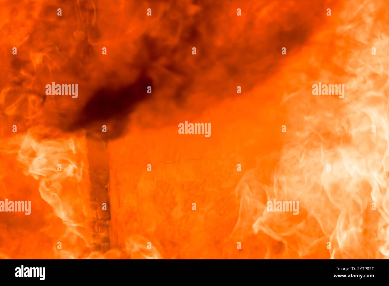 Flames inside a fully involved structure fire Stock Photo - Alamy