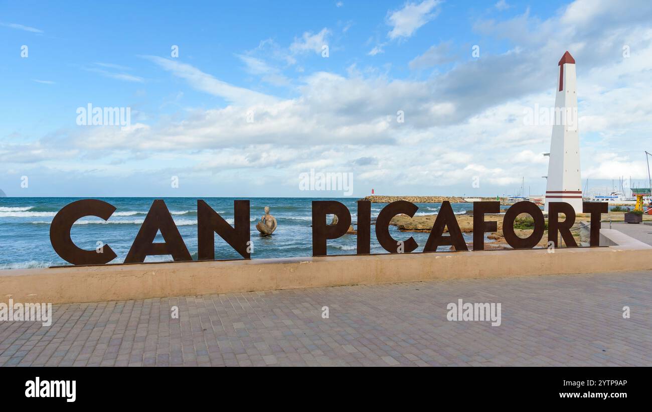 Metal sign with town name at the sea promenade in Can Picaford on ...
