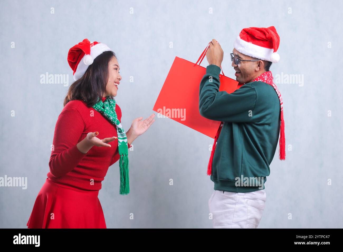 Two people wearing christmas hi-res stock photography and images - Alamy