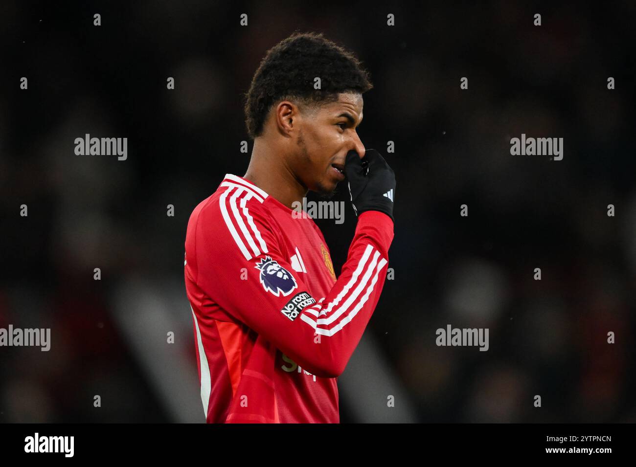 Marcus Rashford of Manchester United holds his nose during the Premier ...