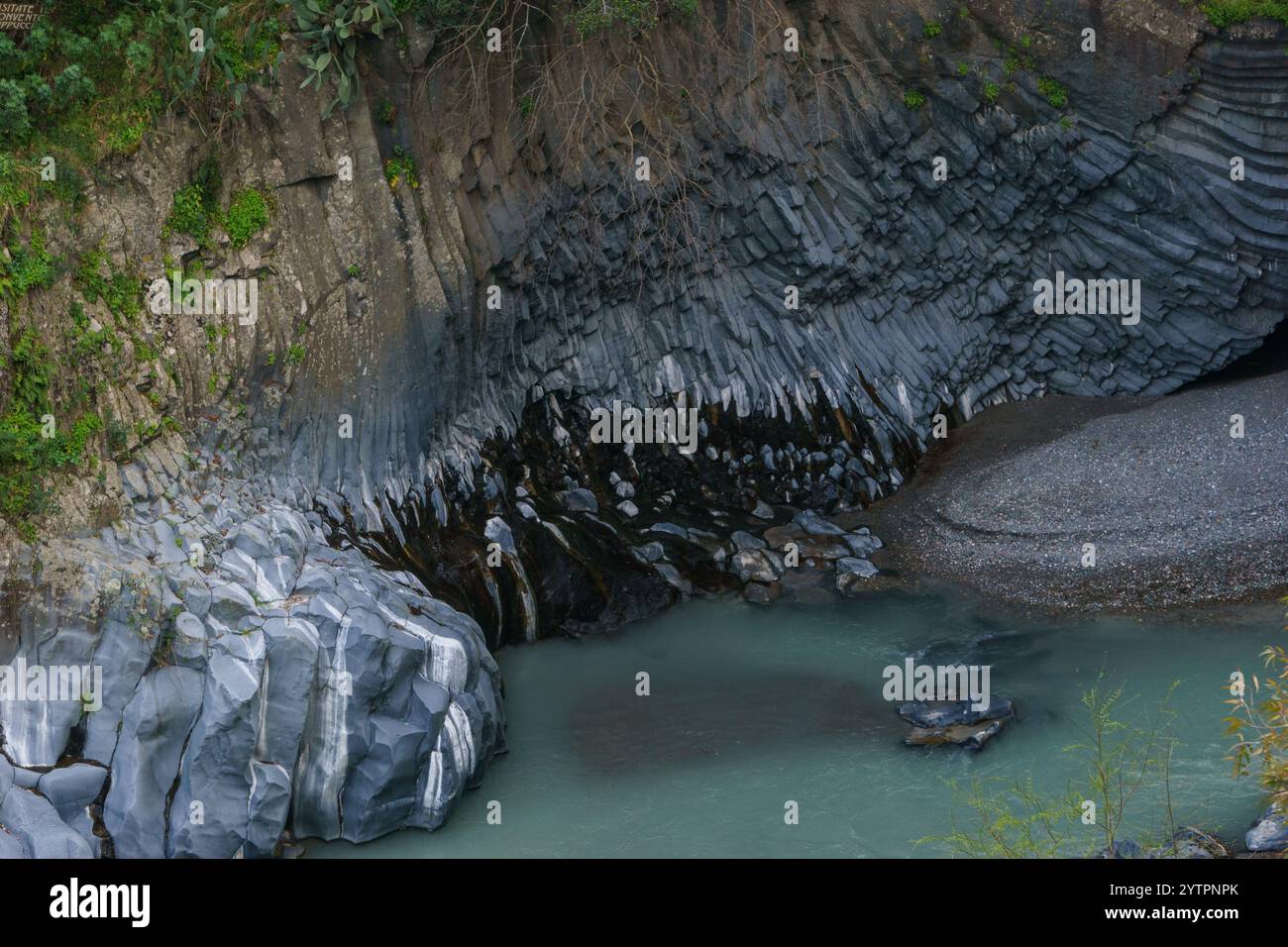 Detail of Gole dell Alcantara gorge formed by basalt columns with river ...