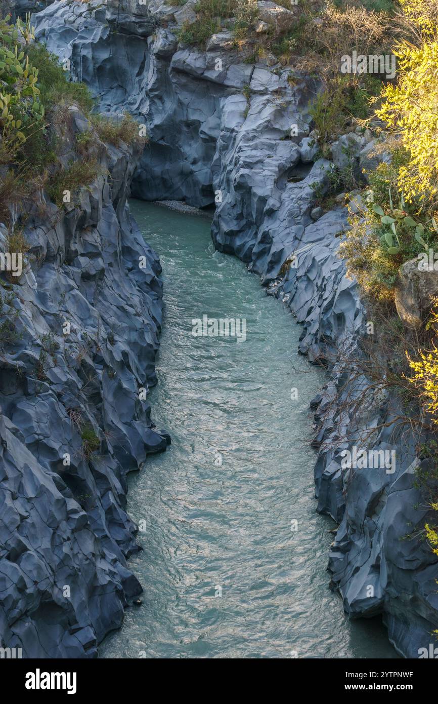 Gole dell Alcantara gorge formed by basalt columns with river near to ...