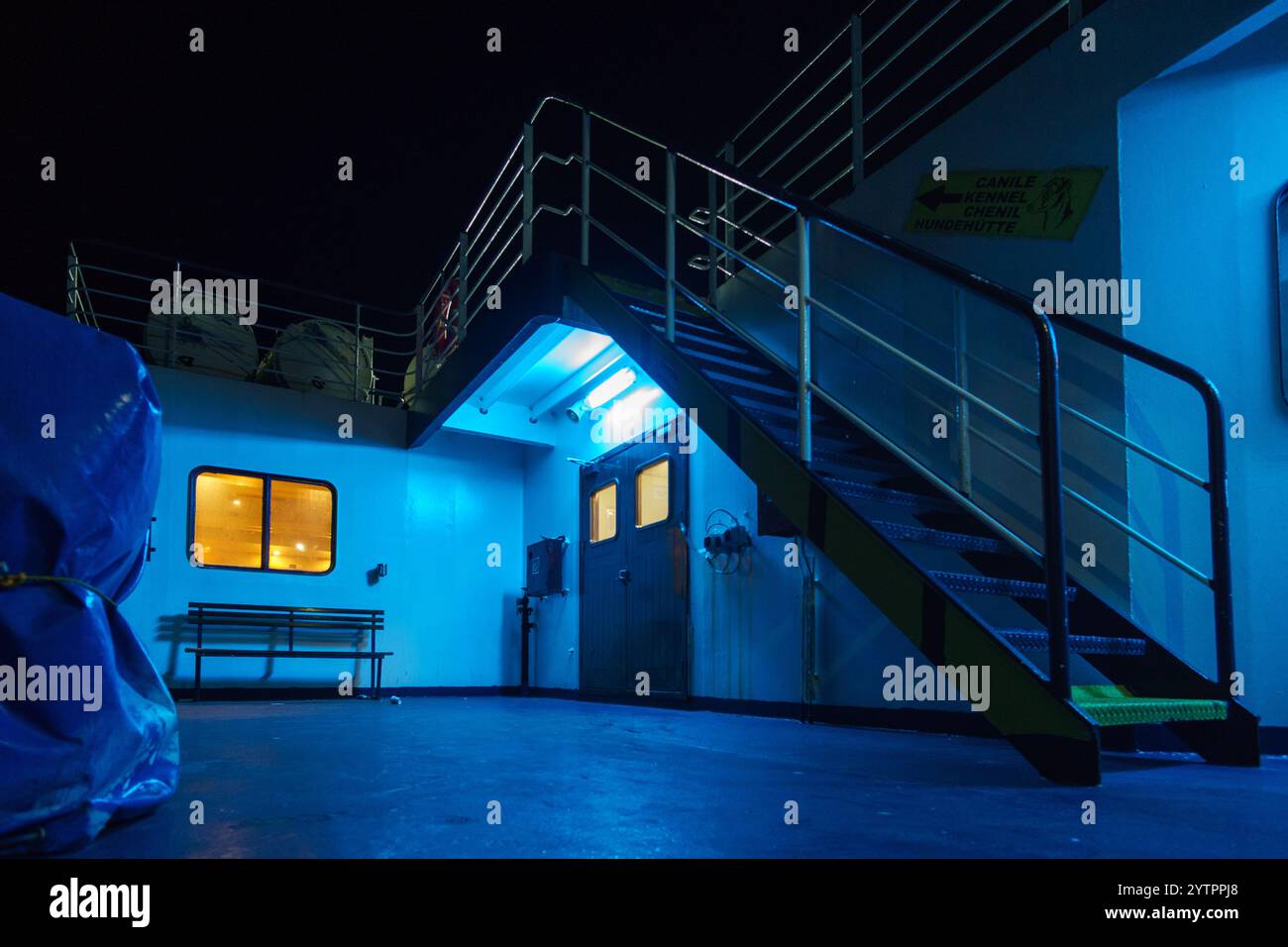Staircase of car ferry boat at illuminated open deck during nighttime ...