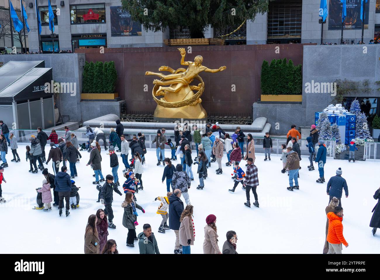 People enjoy ice wskating at the rink at Rockefeller Center in midtown ...