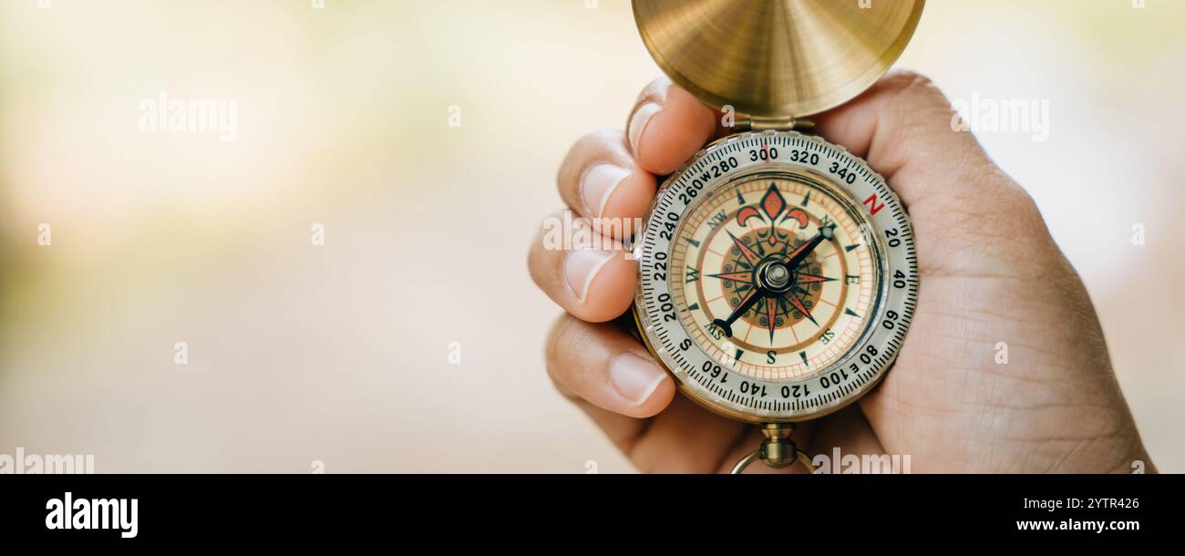 Amidst the forest's beauty a close-up reveals a woman using a compass ...